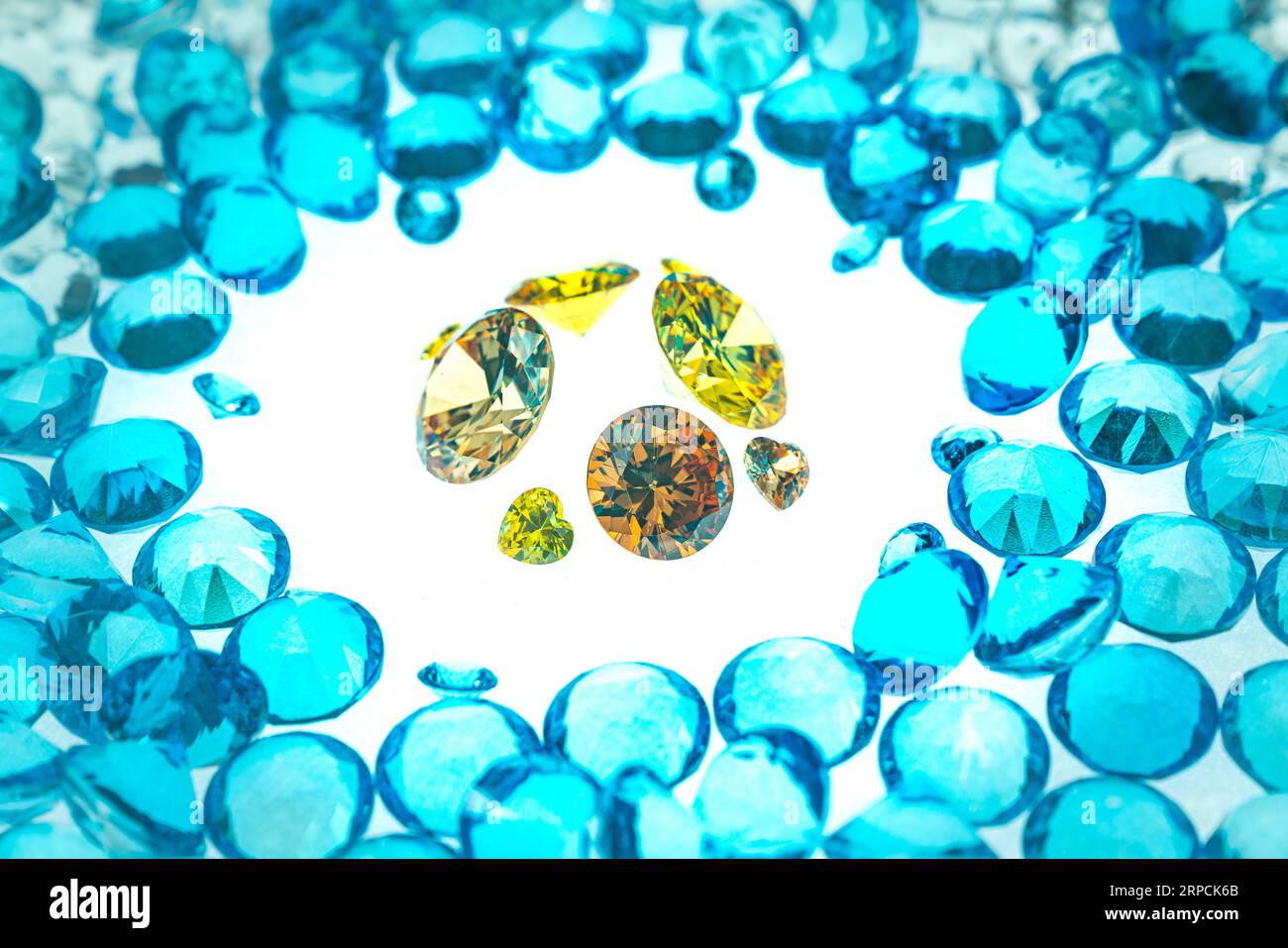 A group of Golden diamonds arranged in a row in front of white diamonds ...