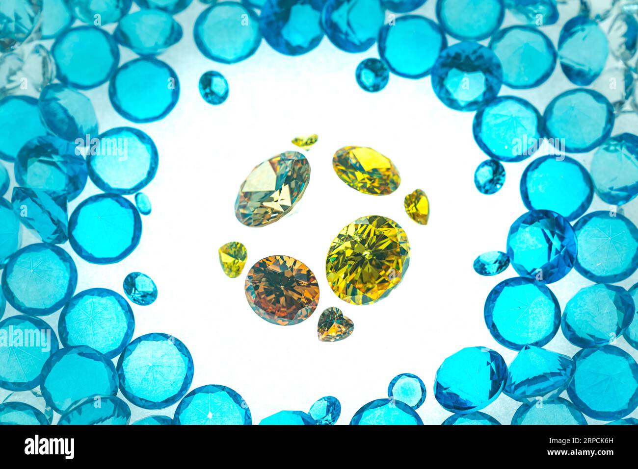 A group of Golden diamonds arranged in a row in front of white diamonds ...