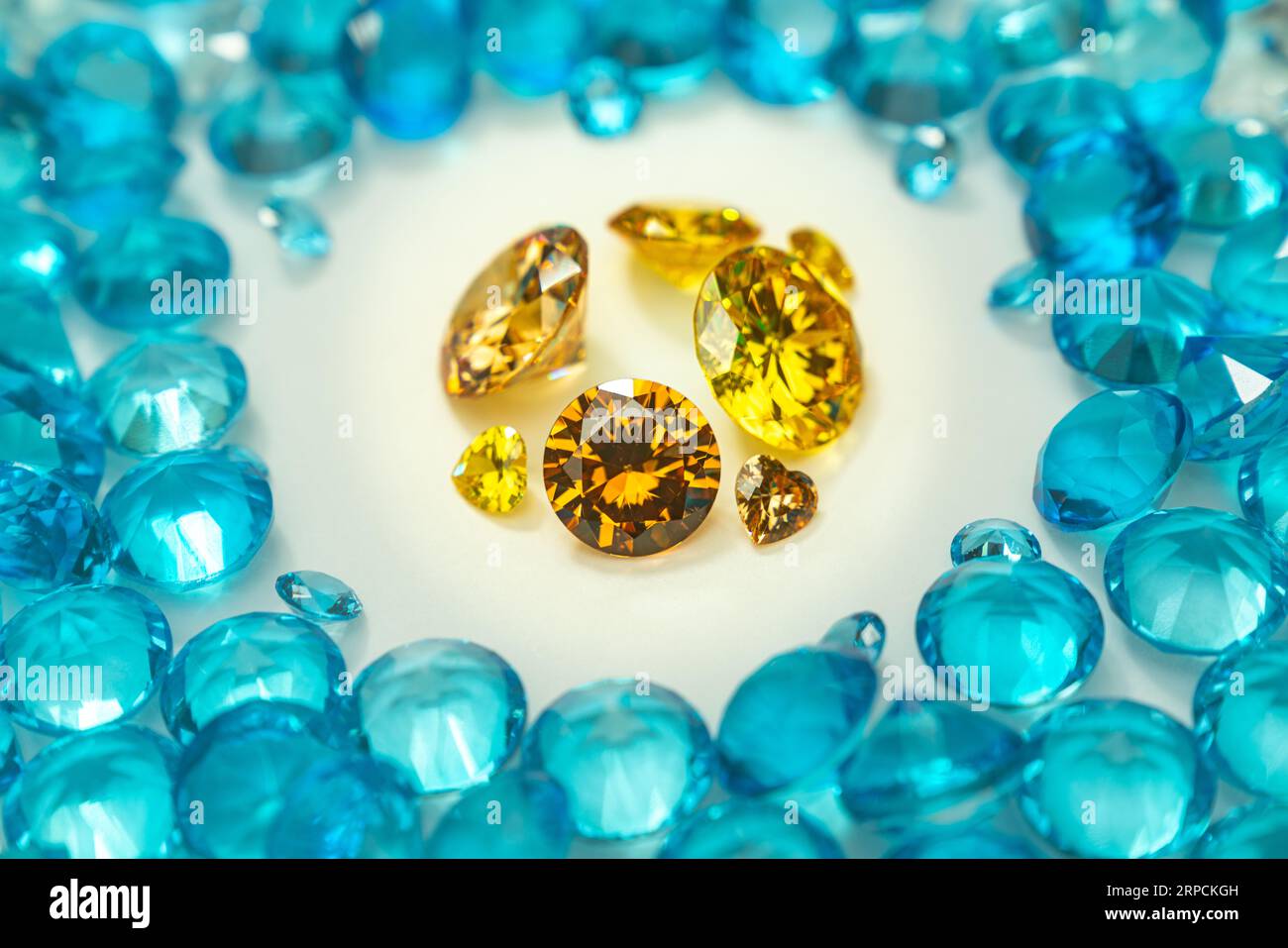 A group of Golden diamonds arranged in a row in front of white diamonds ...