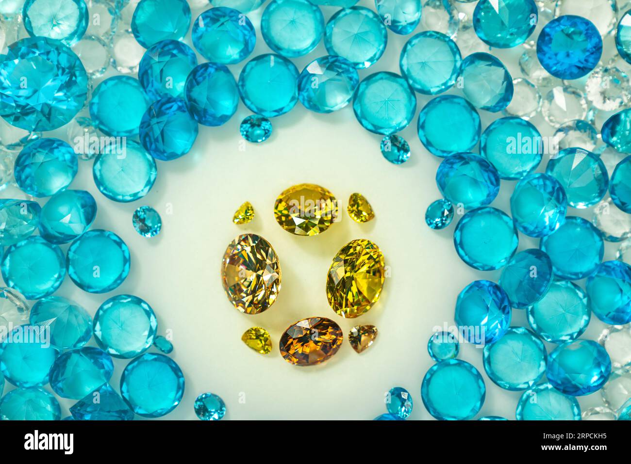 A group of Golden diamonds arranged in a row in front of white diamonds ...