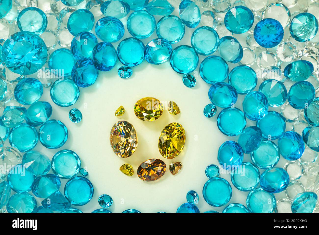 A group of Golden diamonds arranged in a row in front of white diamonds ...