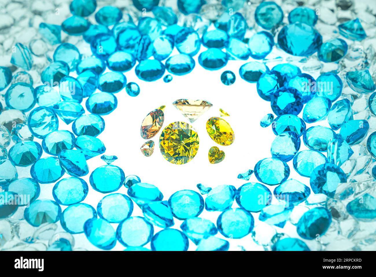 A group of Golden diamonds arranged in a row in front of white diamonds ...