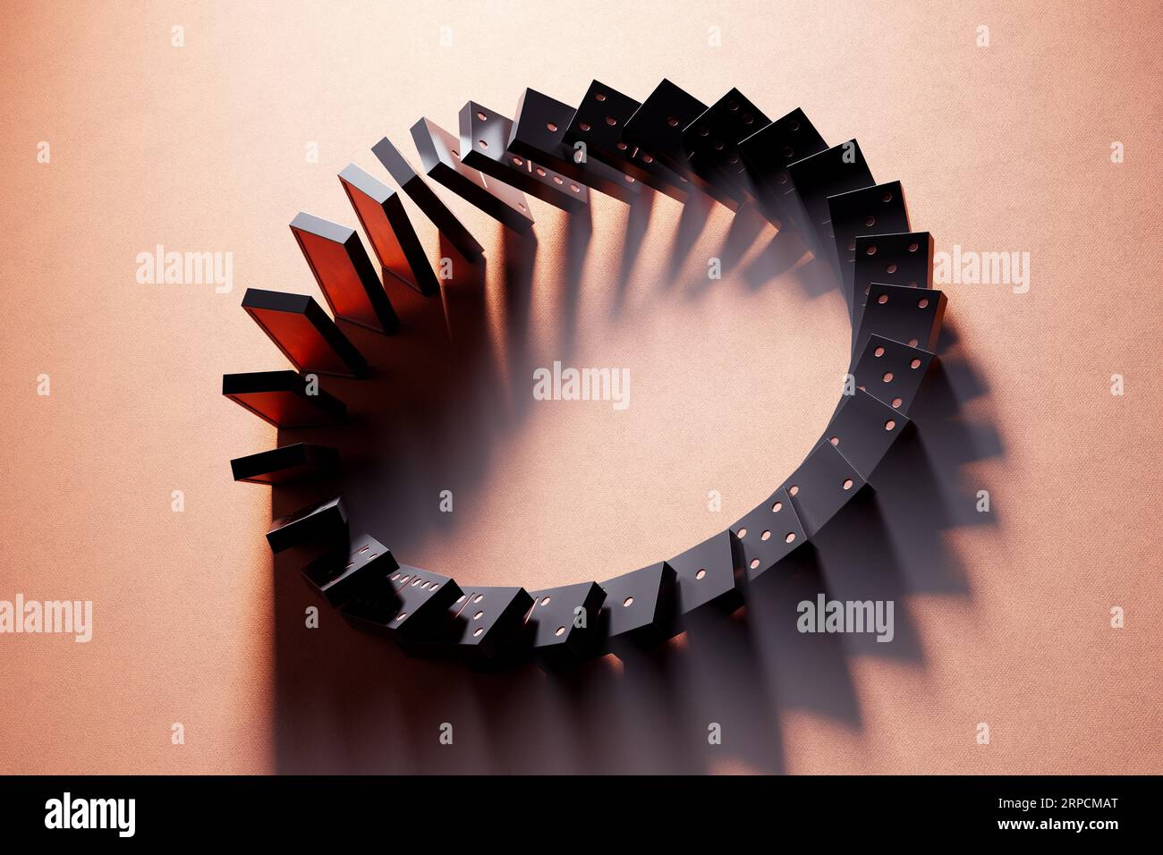 Domino loop falling in moody lighting creates intricate shadows and ...