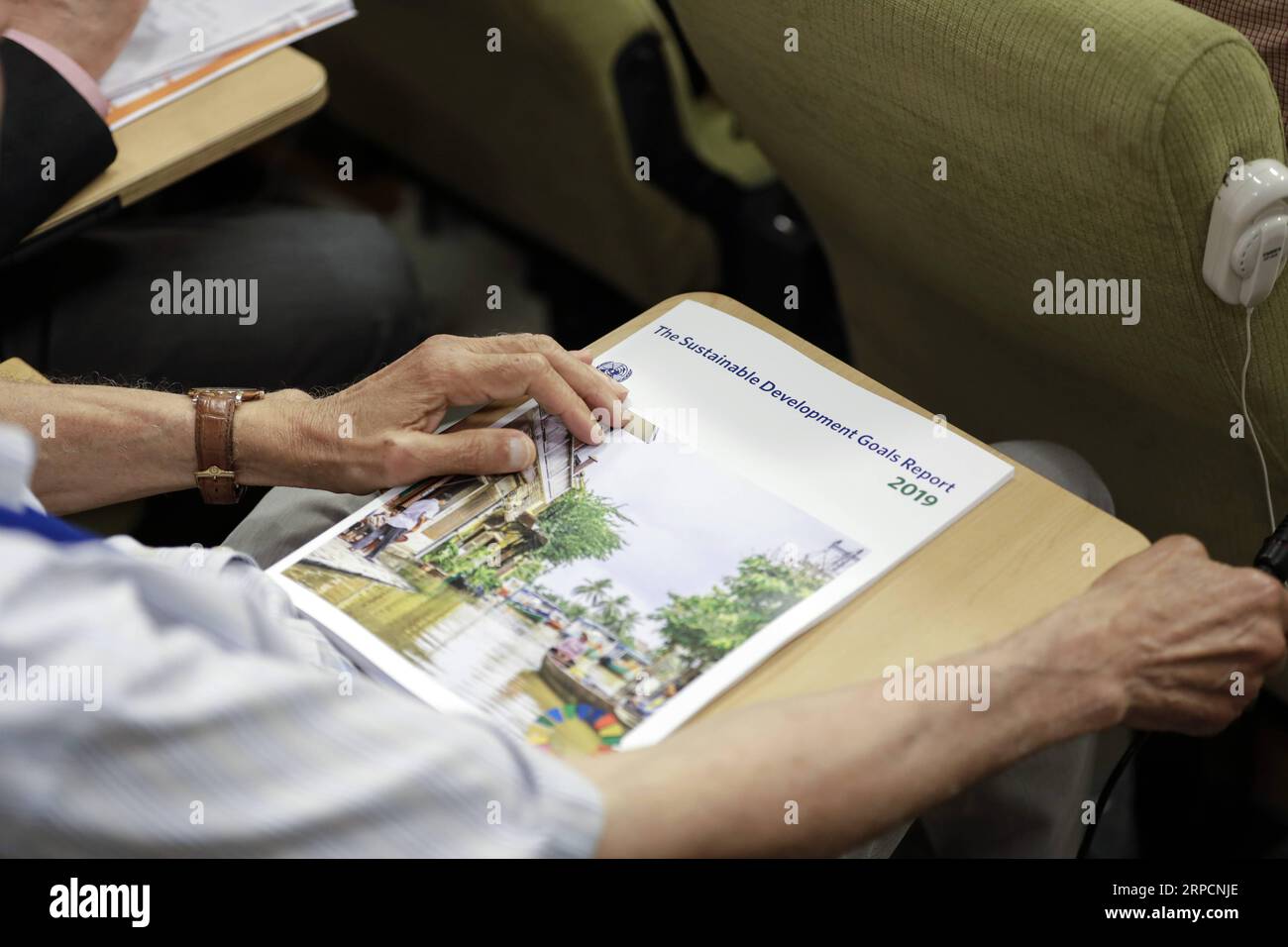 (190709) -- UNITED NATIONS, July 9, 2019 -- A journalist holds a copy ...