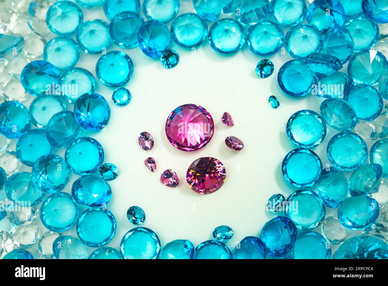 A group of pink diamonds arranged in the middle of blue diamonds in a ...