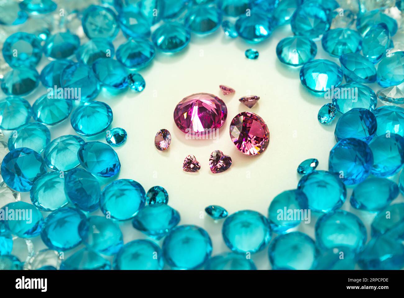 A group of pink diamonds arranged in the middle of blue diamonds in a ...