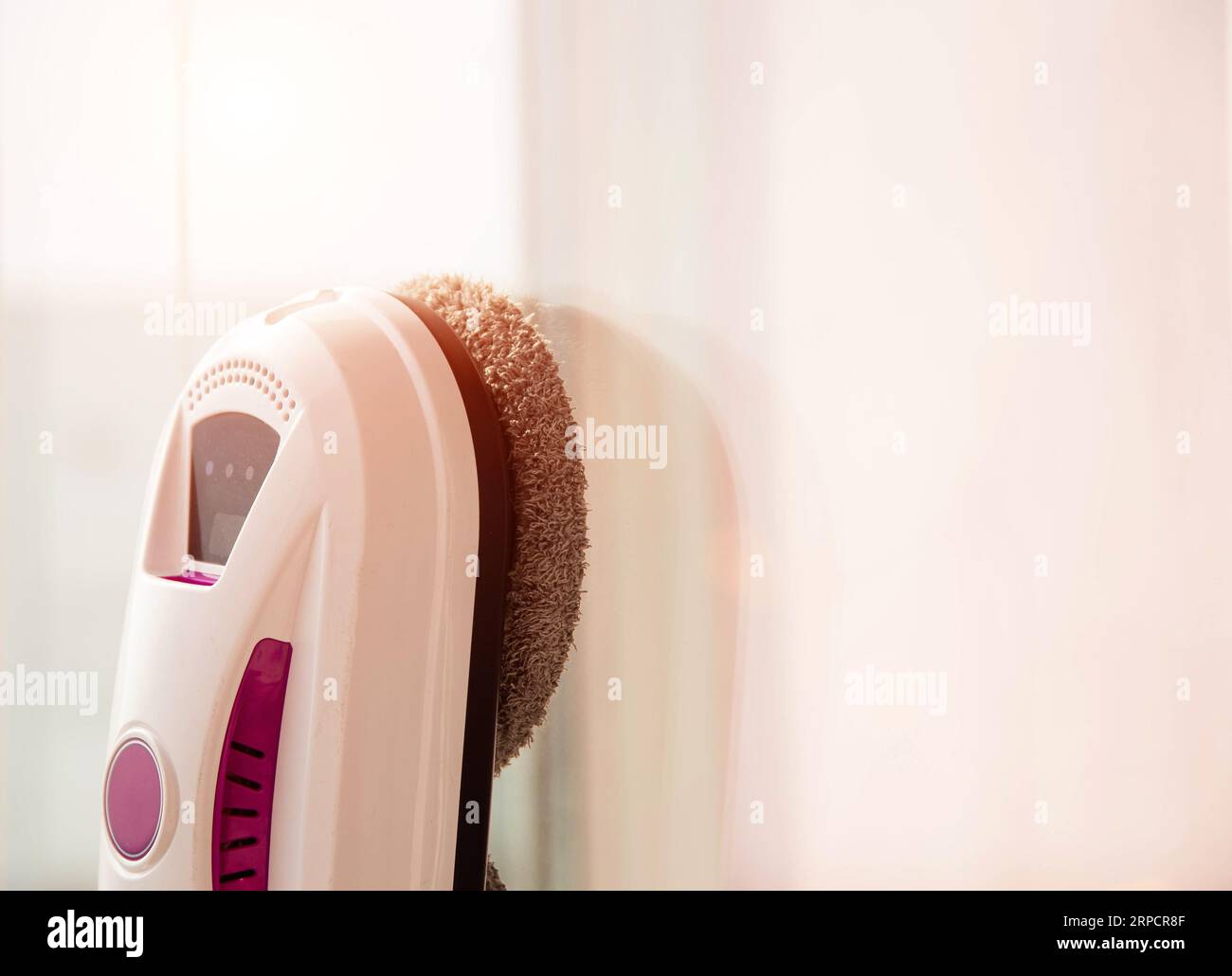 Automatic vacuum robot window washer washes glass from dirt. Modern ...