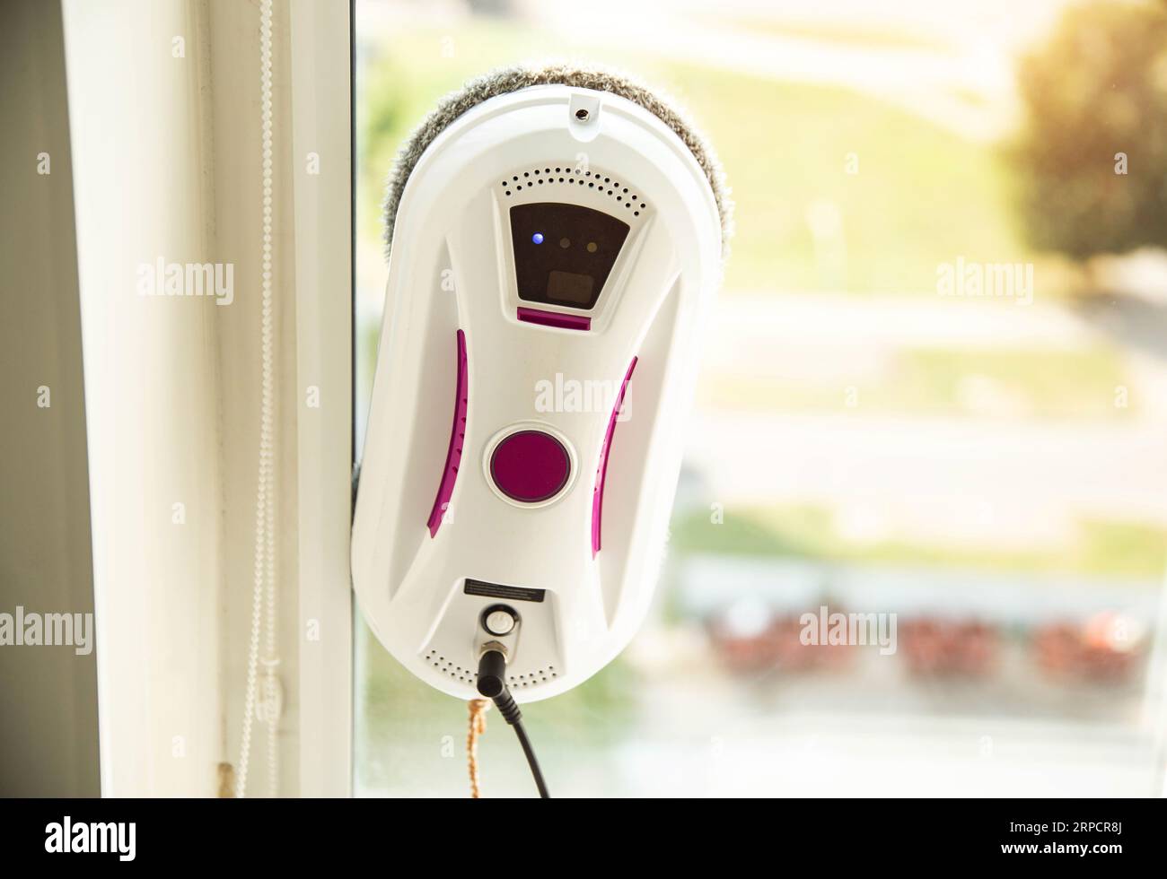 Modern device for cleaning glass from dirt and streaks. Robot washer ...