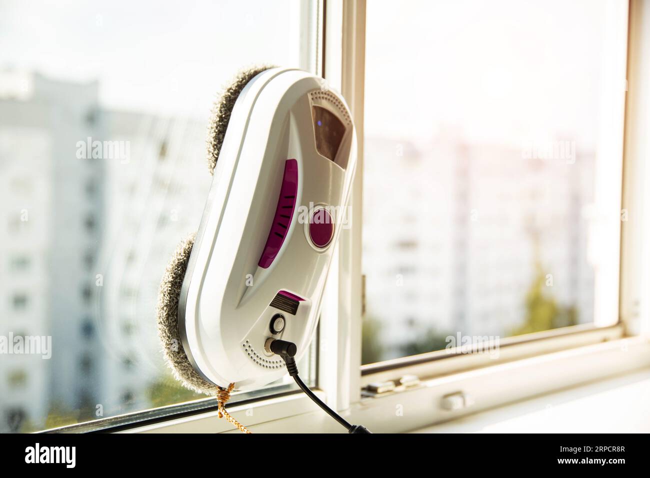 Modern device for cleaning glass from dirt and streaks. Robot washer ...