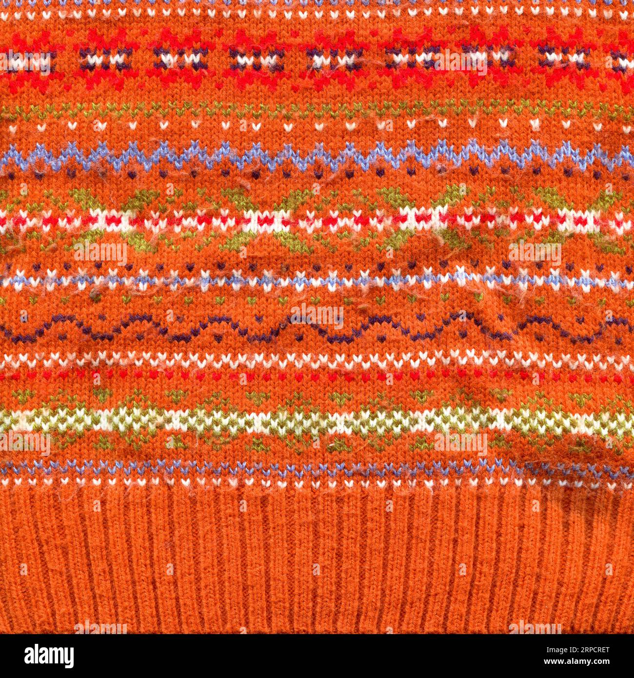 Pattern fabric made of wool. Handmade knitted fabric colored wool ...