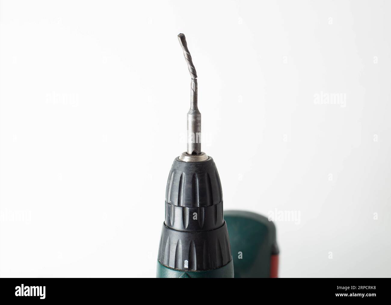 Poor quality broken metal drill on a white background Stock Photo - Alamy