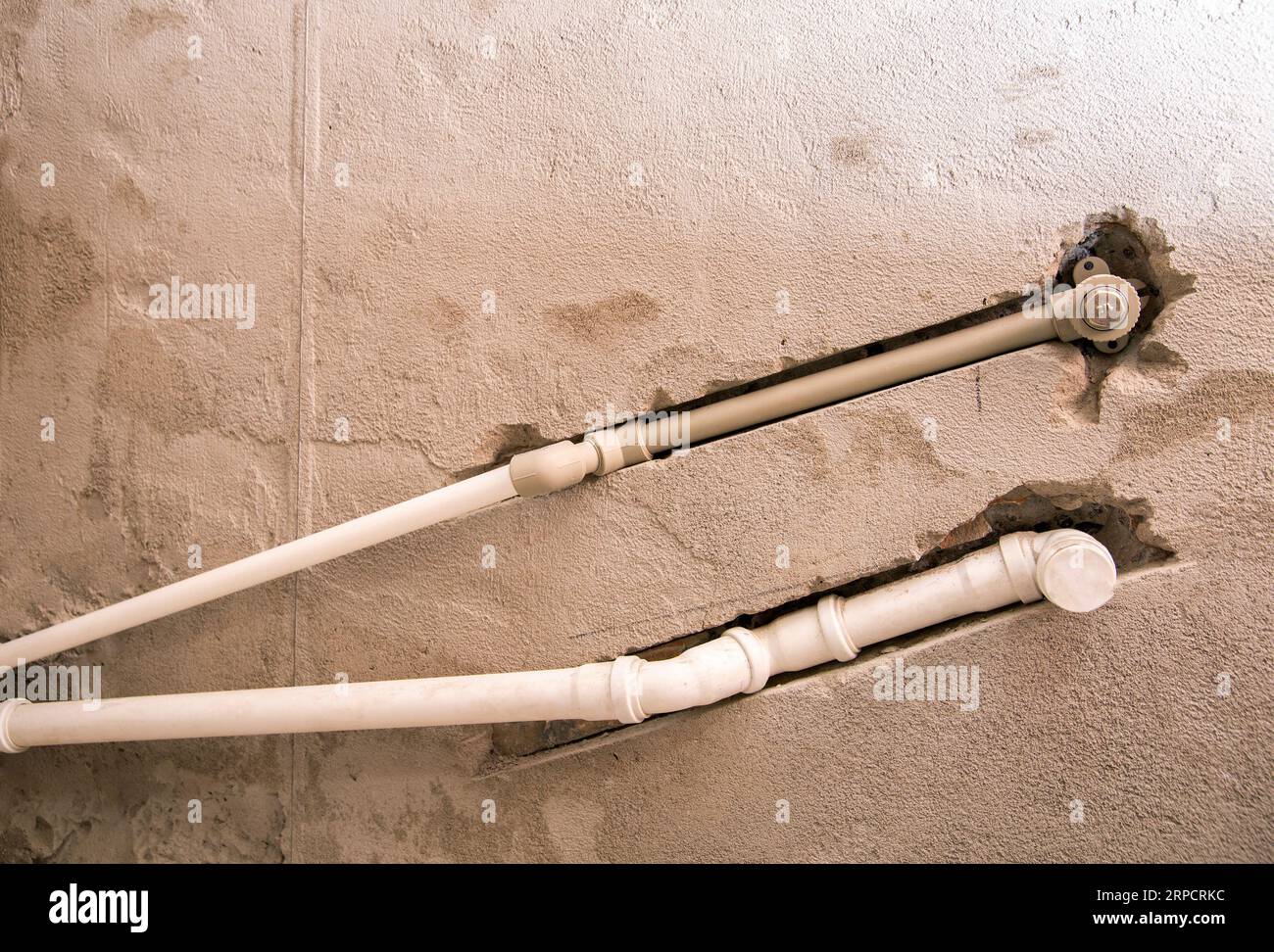 Water supply to the washing machine and sewerage drain in the wall ...