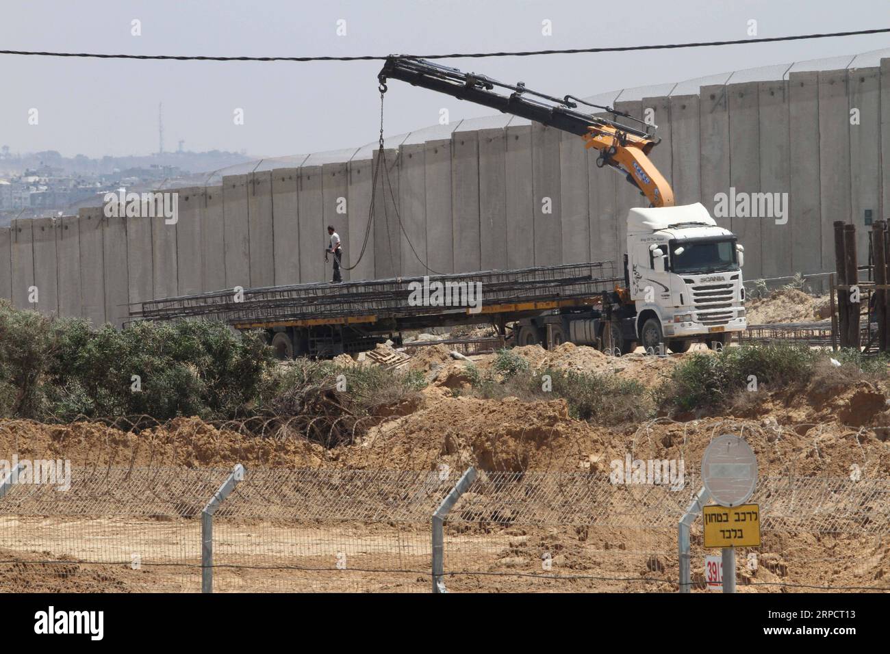 (190712) -- SDEROT, July 12, 2019 -- Israeli construction workers work ...