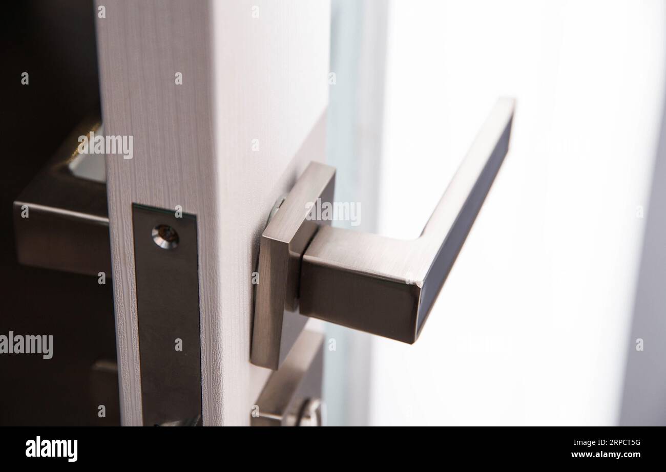 Broken doorknob in interior door. Poor quality fittings Stock Photo - Alamy