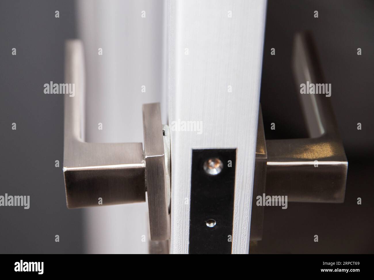 Broken doorknob in interior door. Poor quality fittings Stock Photo - Alamy