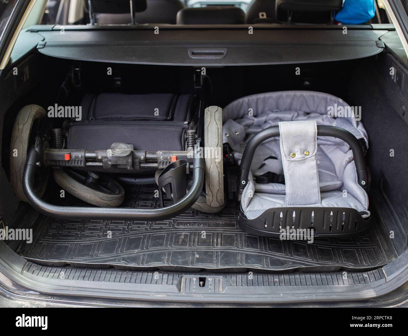 transporting a baby stroller in the trunk of a car when folded Stock ...