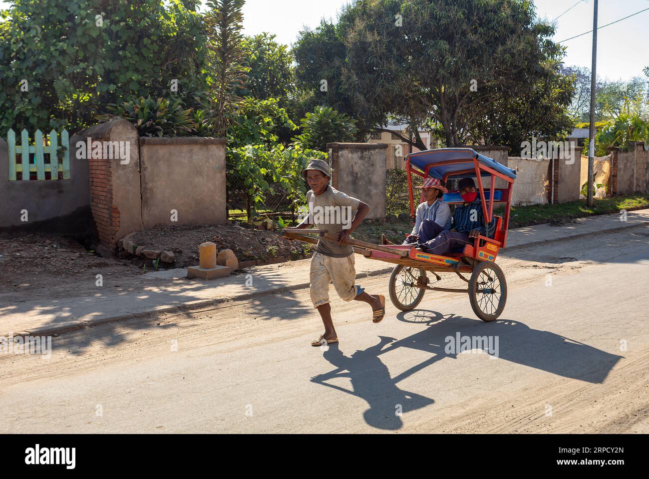 Antsirabe, Madagascar - November 2nd 2022: Rickshaw runner dashes ...