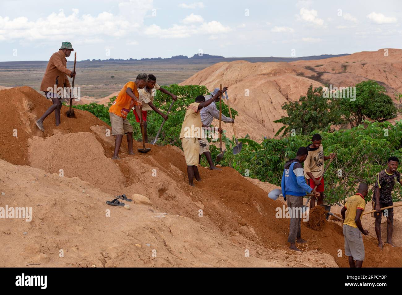 Ilakaka, Madagascar - November 24th 2022 - Working in tandem, miners ...