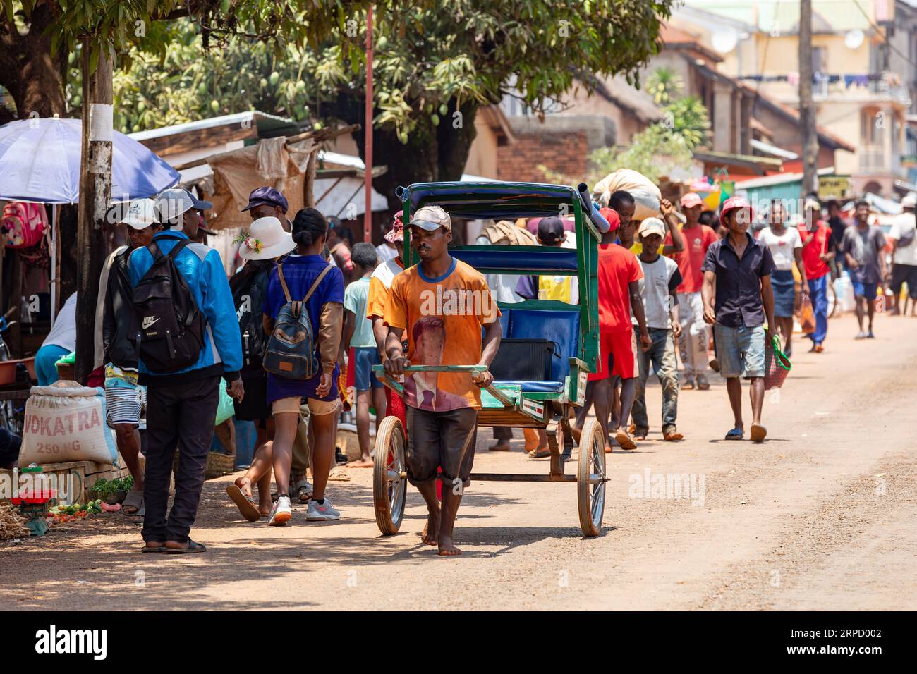 Mandoto, Madagascar - November 2nd 2022: Rickshaw runner dashes through ...