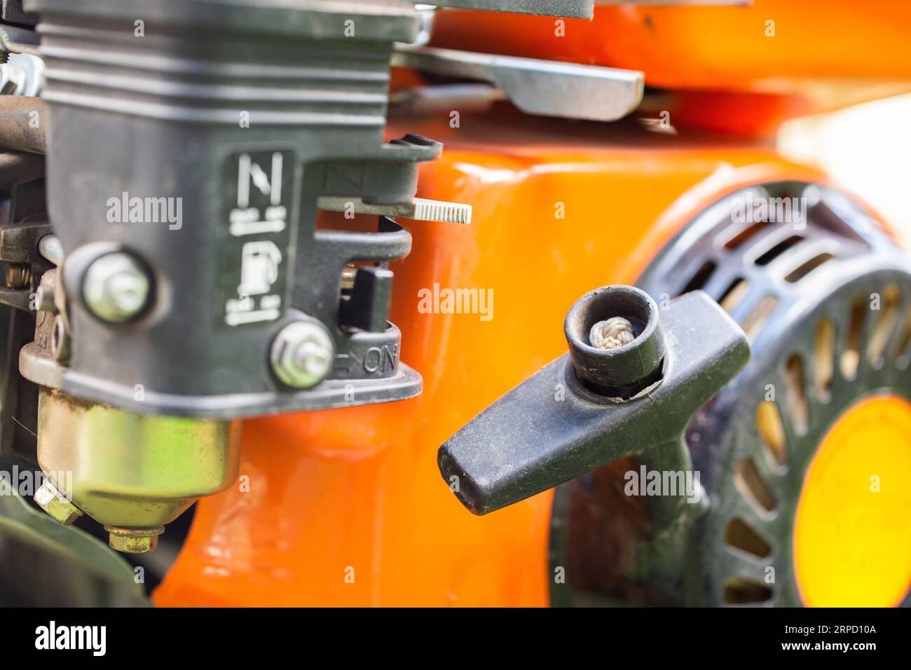Manual starter handle for starting a walk-behind tractor Stock Photo ...