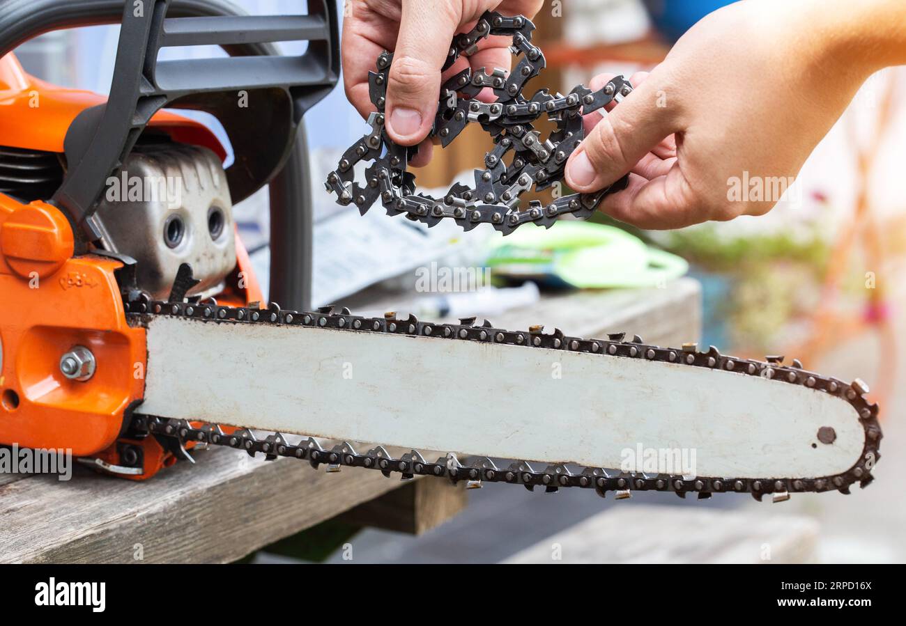 New chain for chainsaw. Setting up and replacing the chain on the ...