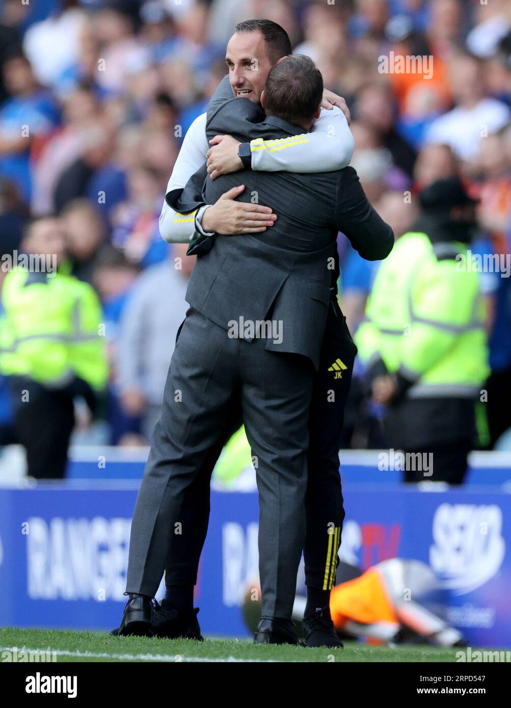 Celtic assistant manager John Kennedy hugs Manager Brendan Rodgers ...