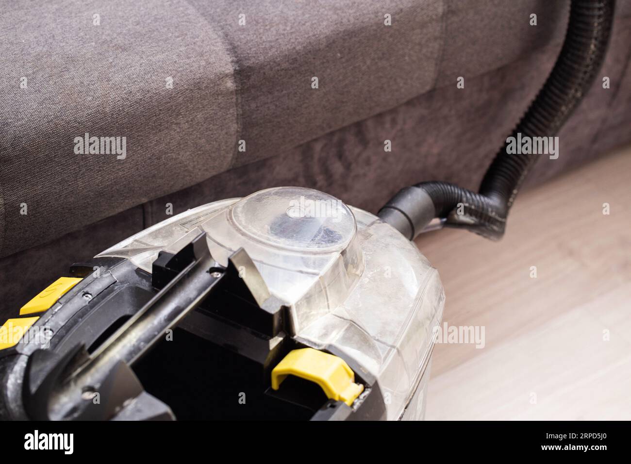 Modern professional washing vacuum cleaner for upholstered furniture on ...