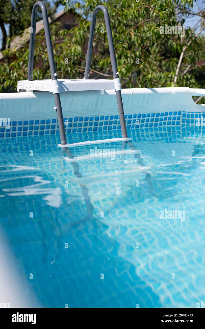 Frame swimming pool in the yard Sunny day. Holidays concept Stock Photo ...