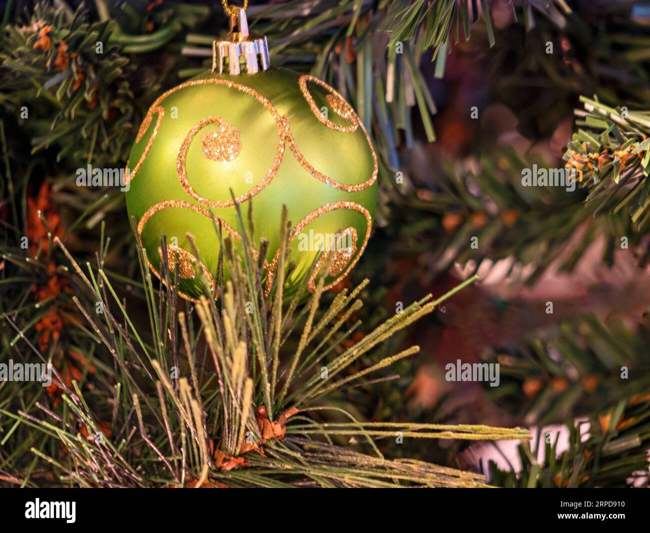 Green decorative ball on Christmas pine tree brench Stock Photo - Alamy