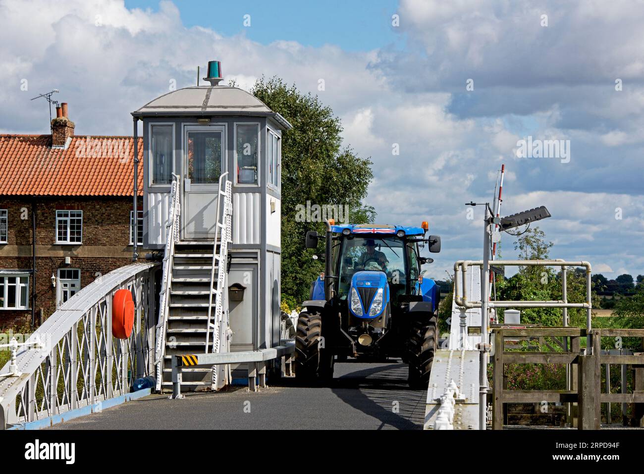 Tracor crossing the swing bridge across the river Ouse at Cawood, North ...