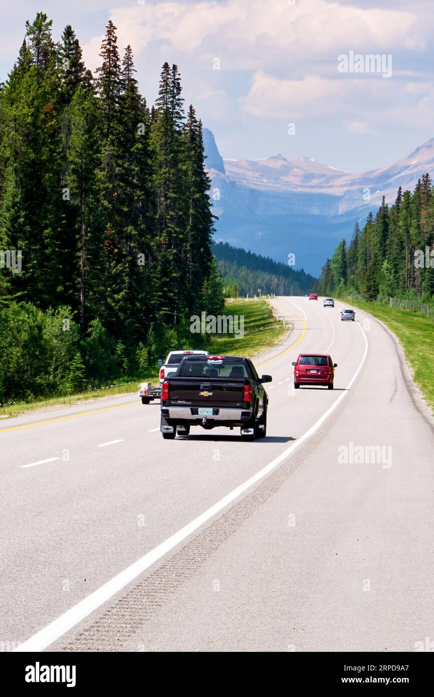 Vehicles driving on the Transcanada Highway through the Rocky Mountains ...