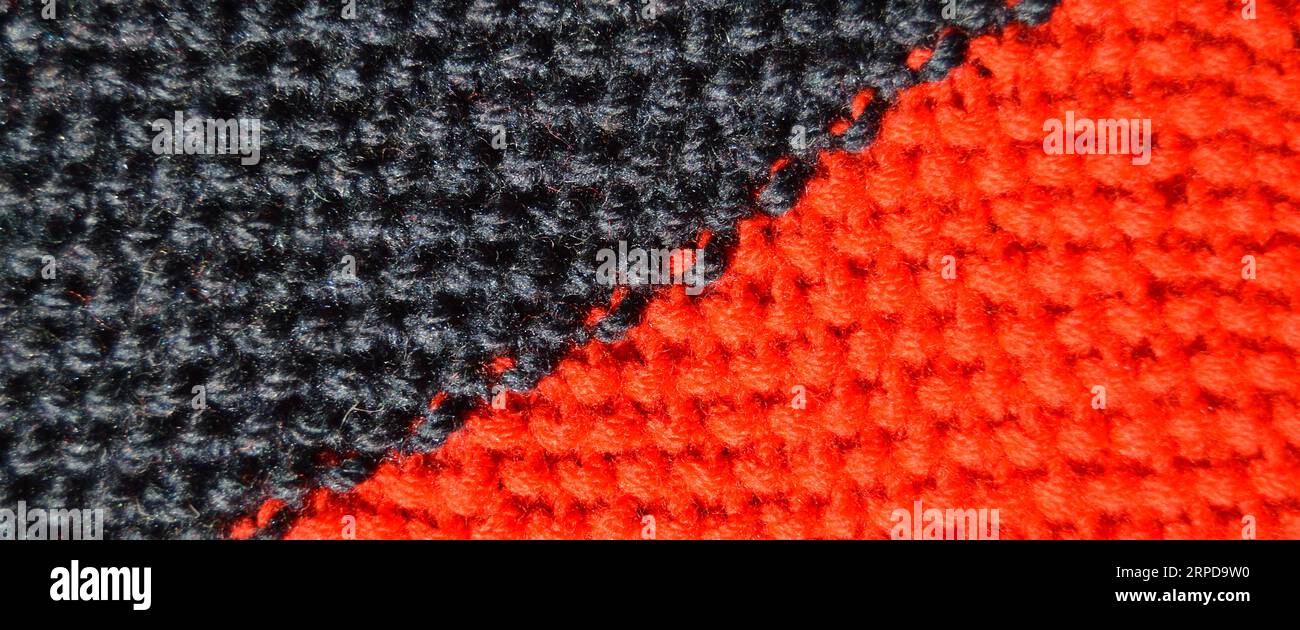 Pattern fabric made of wool. Handmade knitted fabric red and black wool ...