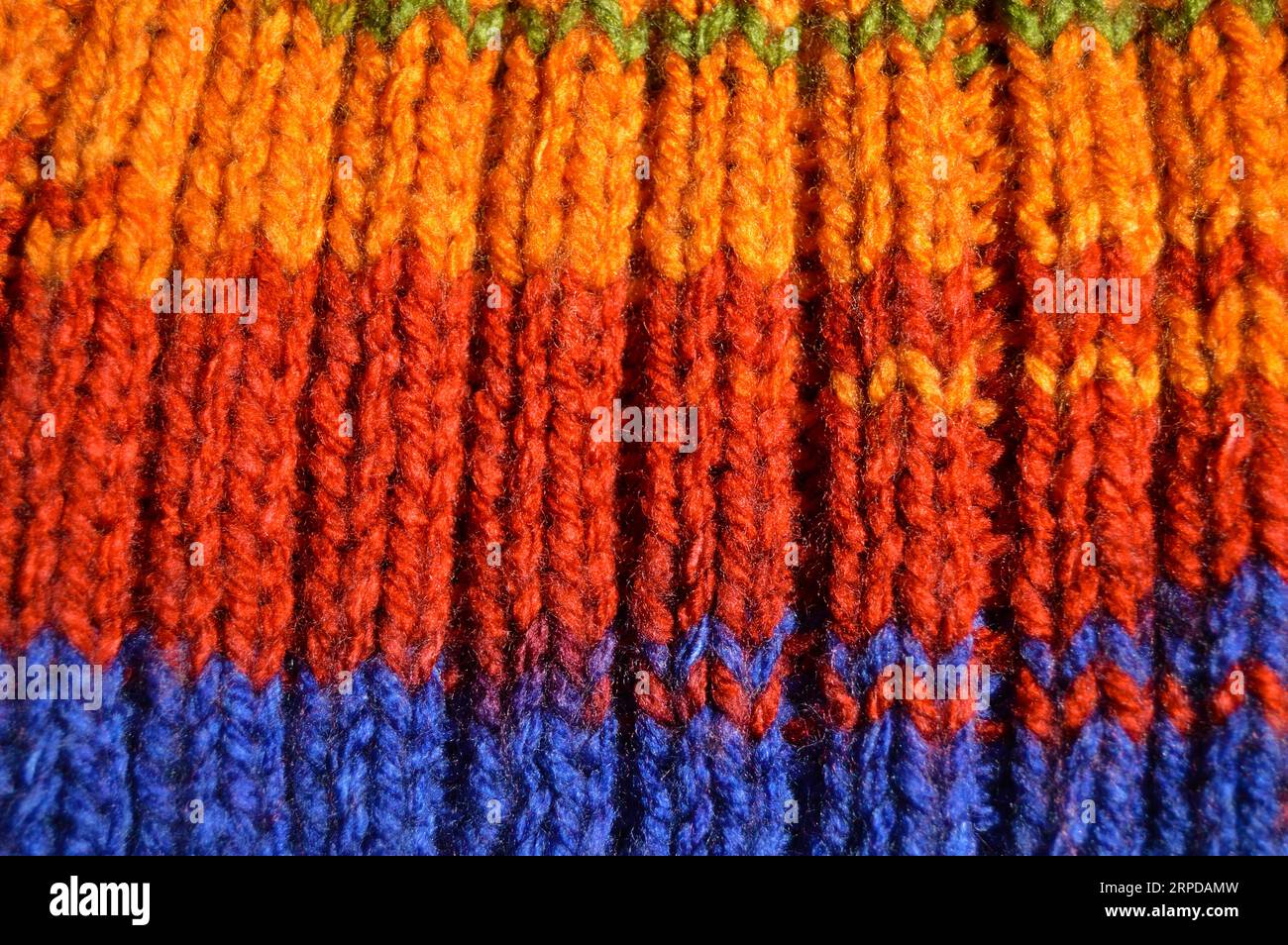 Pattern fabric made of wool. Handmade knitted fabric colored wool ...
