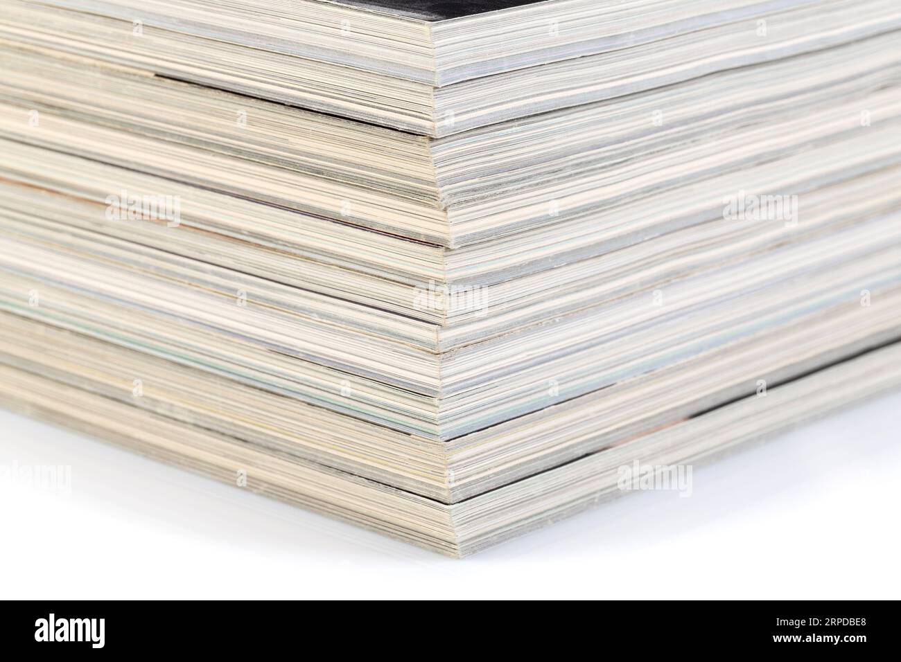 A stack of magazines isolated on a white background Stock Photo - Alamy