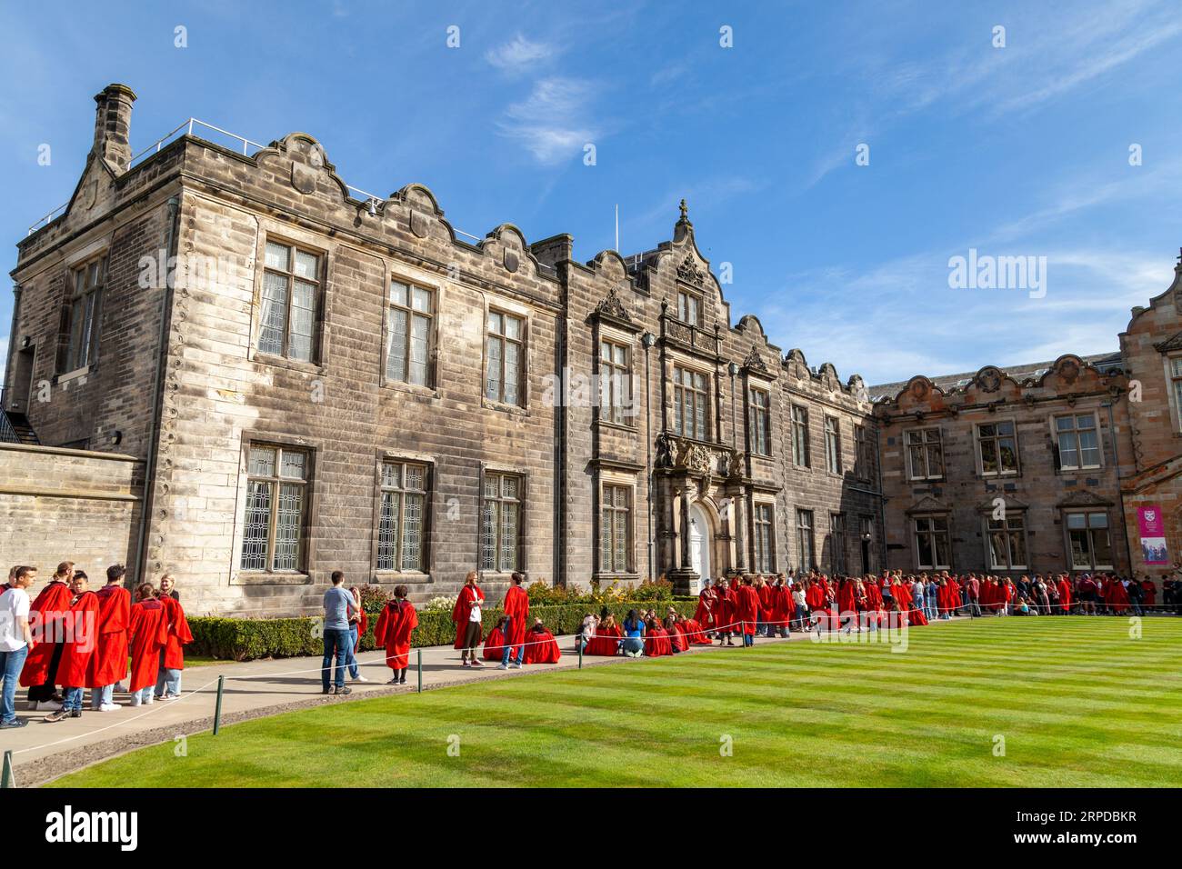 New students at the University of St Andrews wearing red robes gather ...