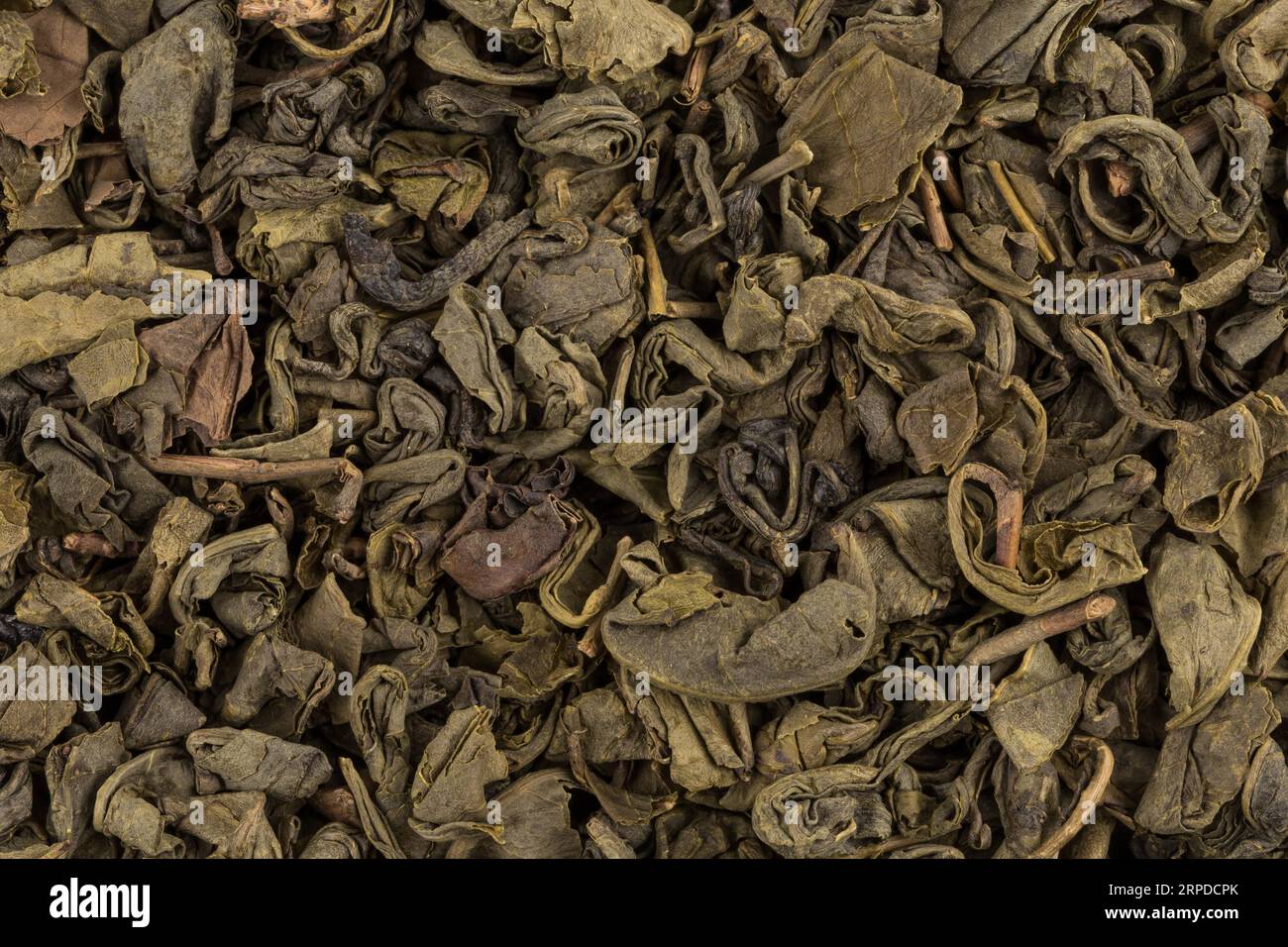 Gunpowder green tea closeup photo for background Stock Photo - Alamy