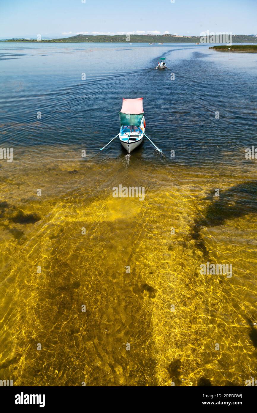 Touristic sightseeing wooden boats around Ulubat or Uluabat Lake in ...
