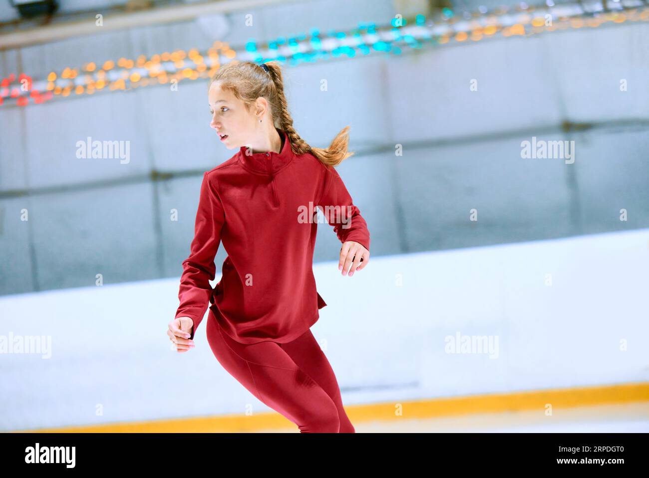 Teen girl, figure skating athlete in motion during training session on ...