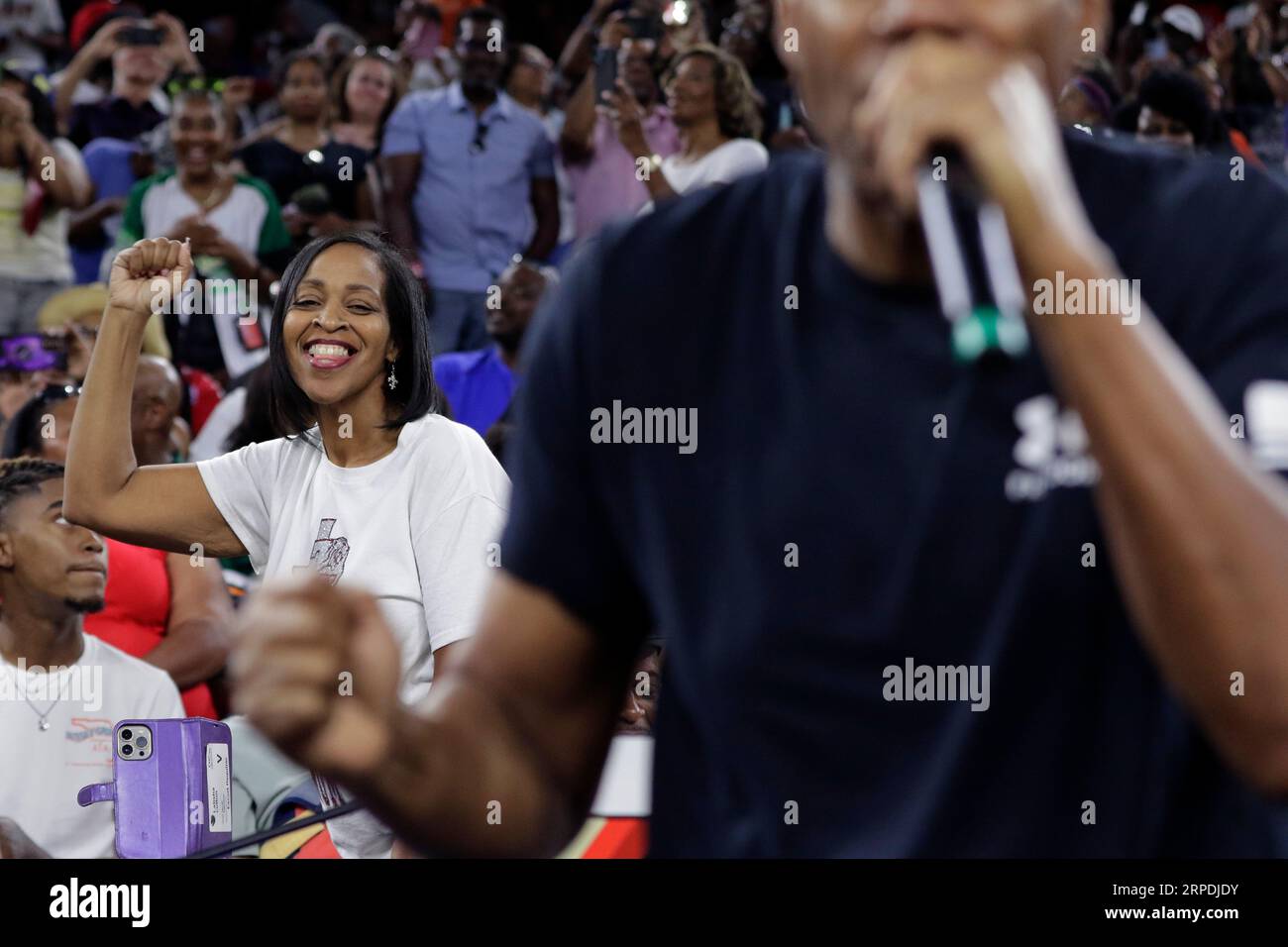 A fan, left, in the stands dances as Rapper Doug E. Fresh performs ...