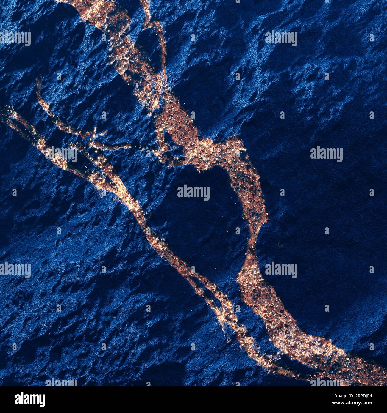 Shiny gold vein in the solid rock. Expensive noble metal. Golden ore ...