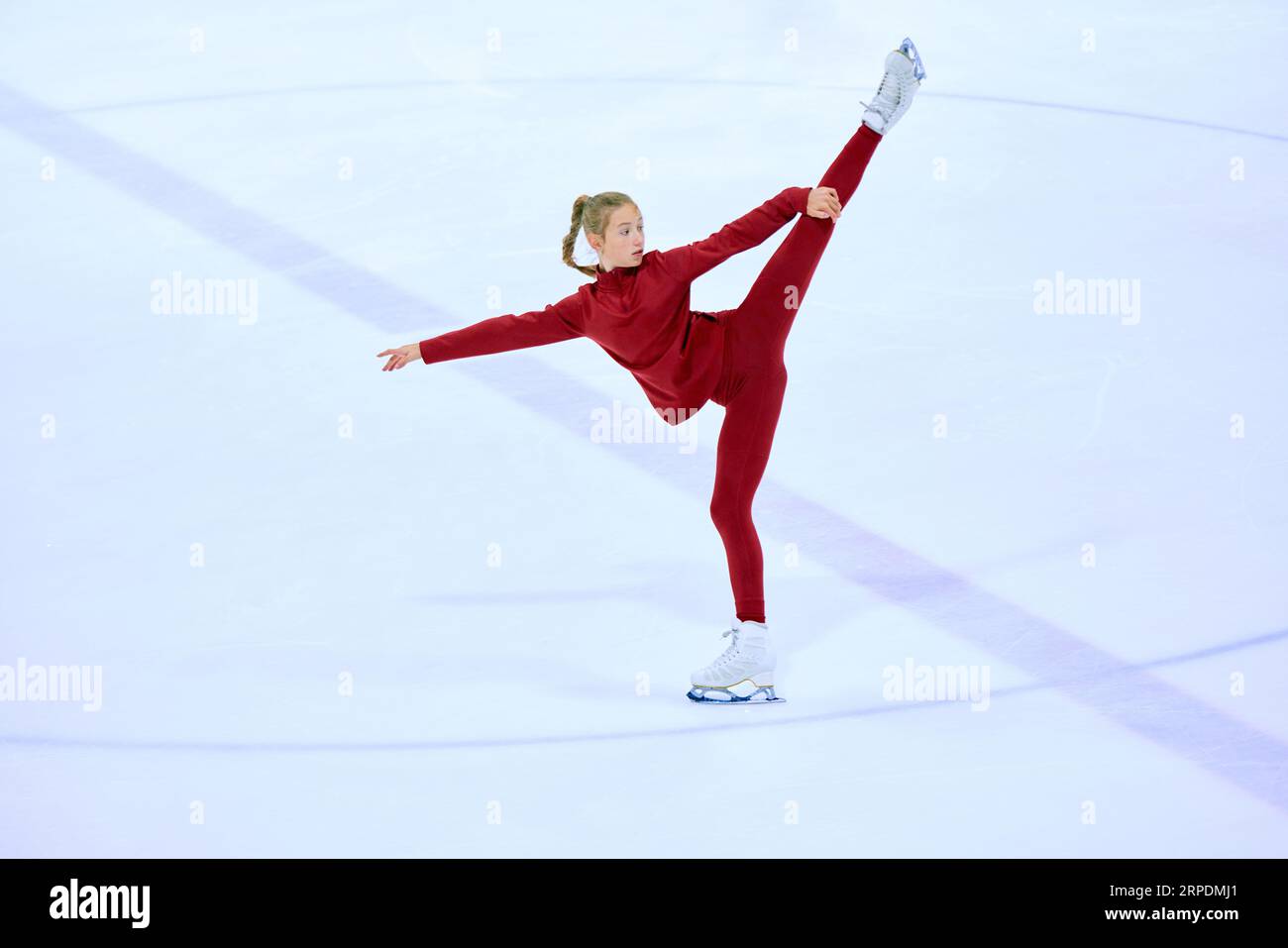 Talented, artistic and concentrated girl, figure skating athlete in ...
