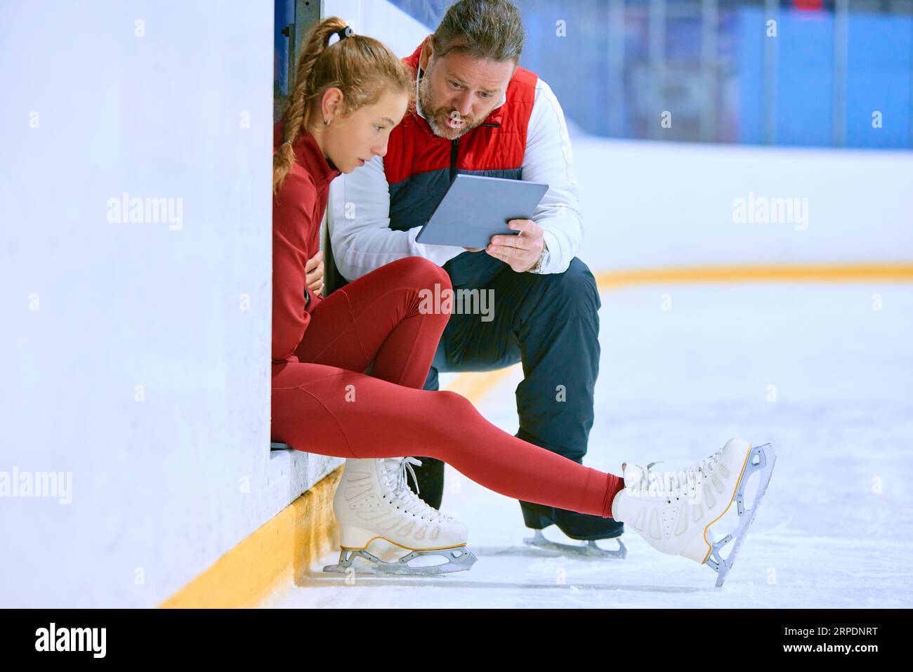 Child figure skating and coach hi-res stock photography and images - Alamy