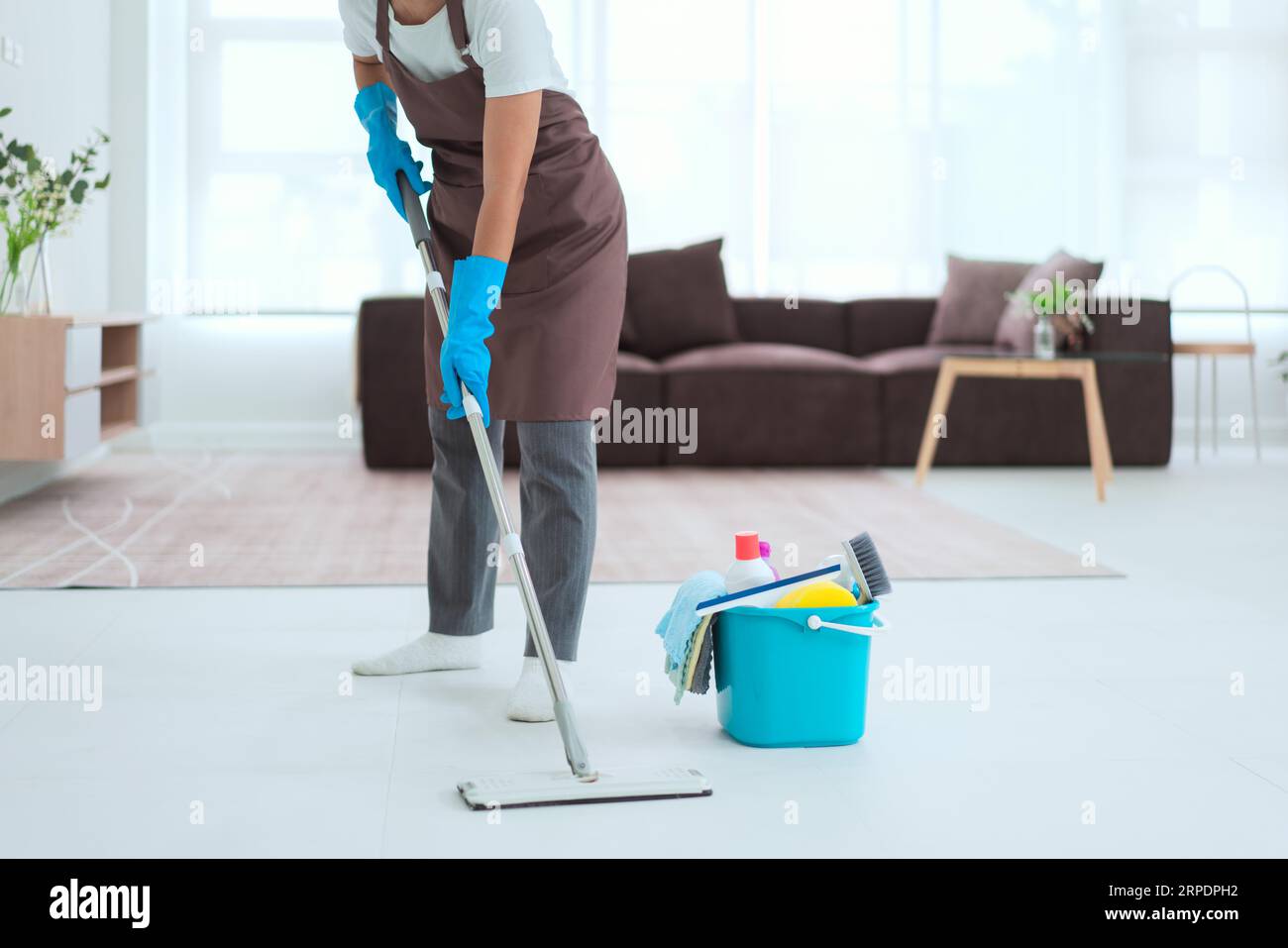 Maid using mop with bucket plastic of cleaner equipment to mopping ...