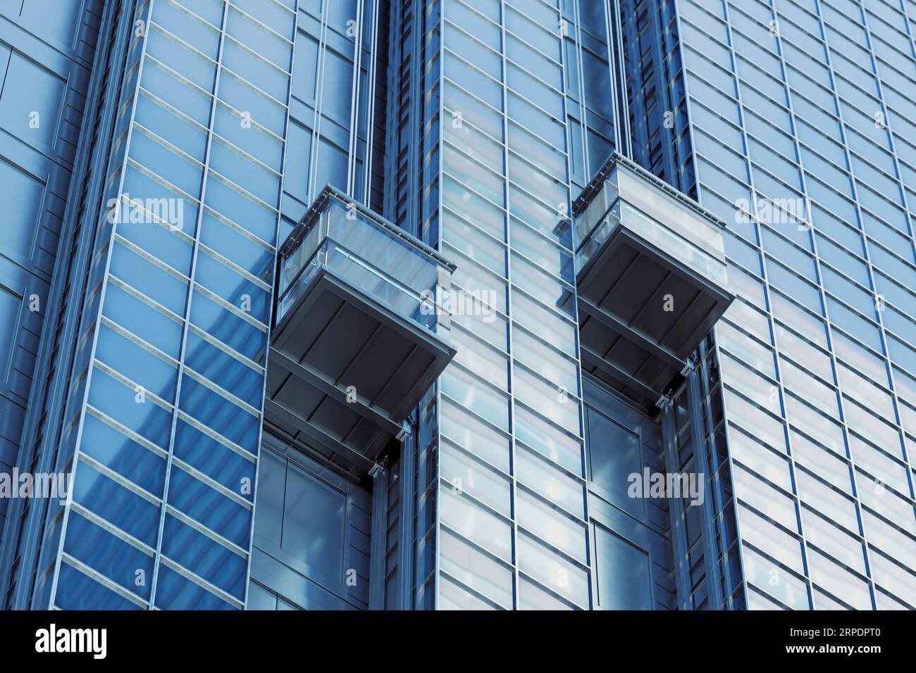 Two external elevators going up along a tall skyscraper. Reflective glass facade Stock Photo - Alamy