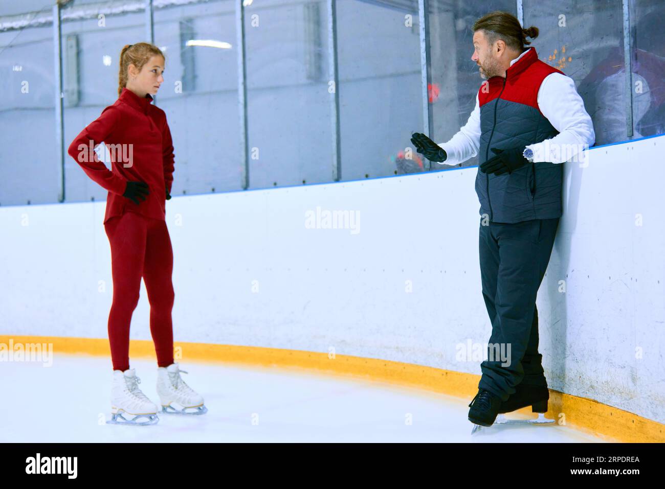 Child figure skating and coach hi-res stock photography and images - Alamy