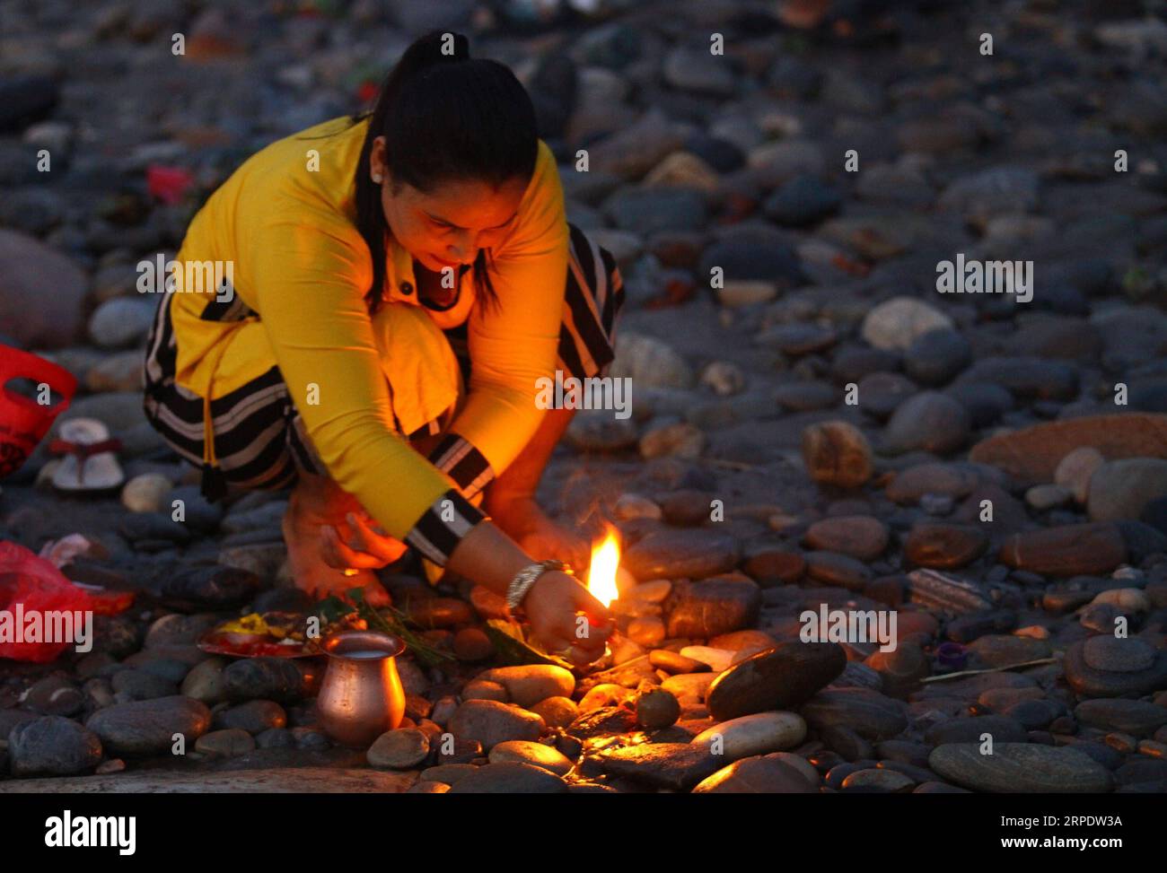 (190812) -- CHITWAN, Aug. 12, 2019 -- A woman offers prayers to Lord ...