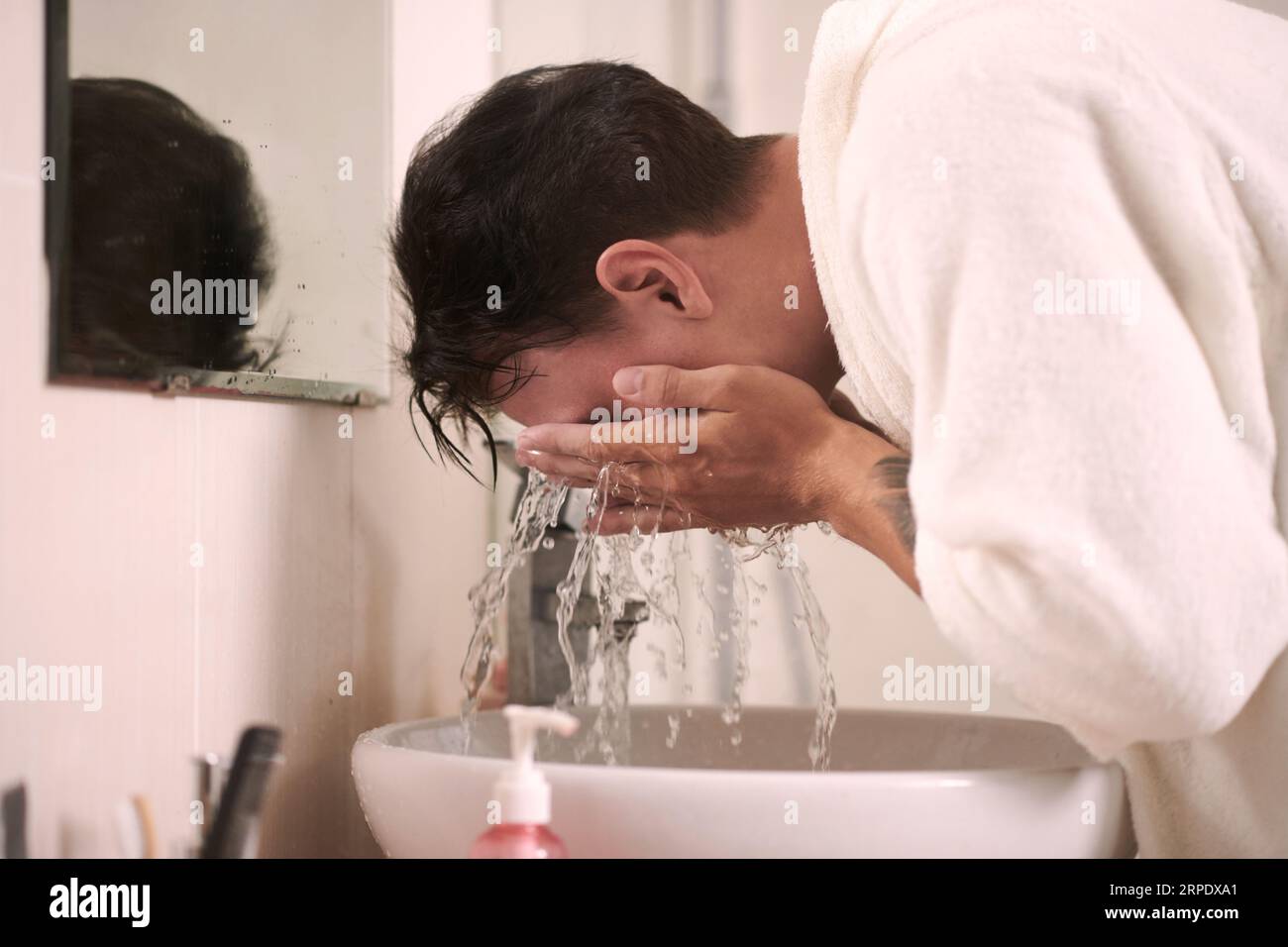 Adult bending over sink hi-res stock photography and images - Alamy