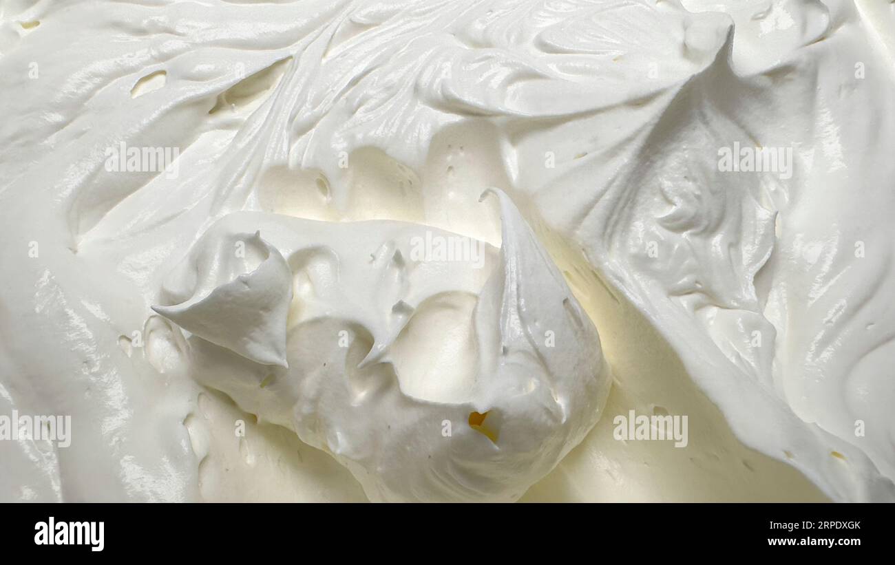 Whipped cream. Fresh whipped cream background Stock Photo - Alamy