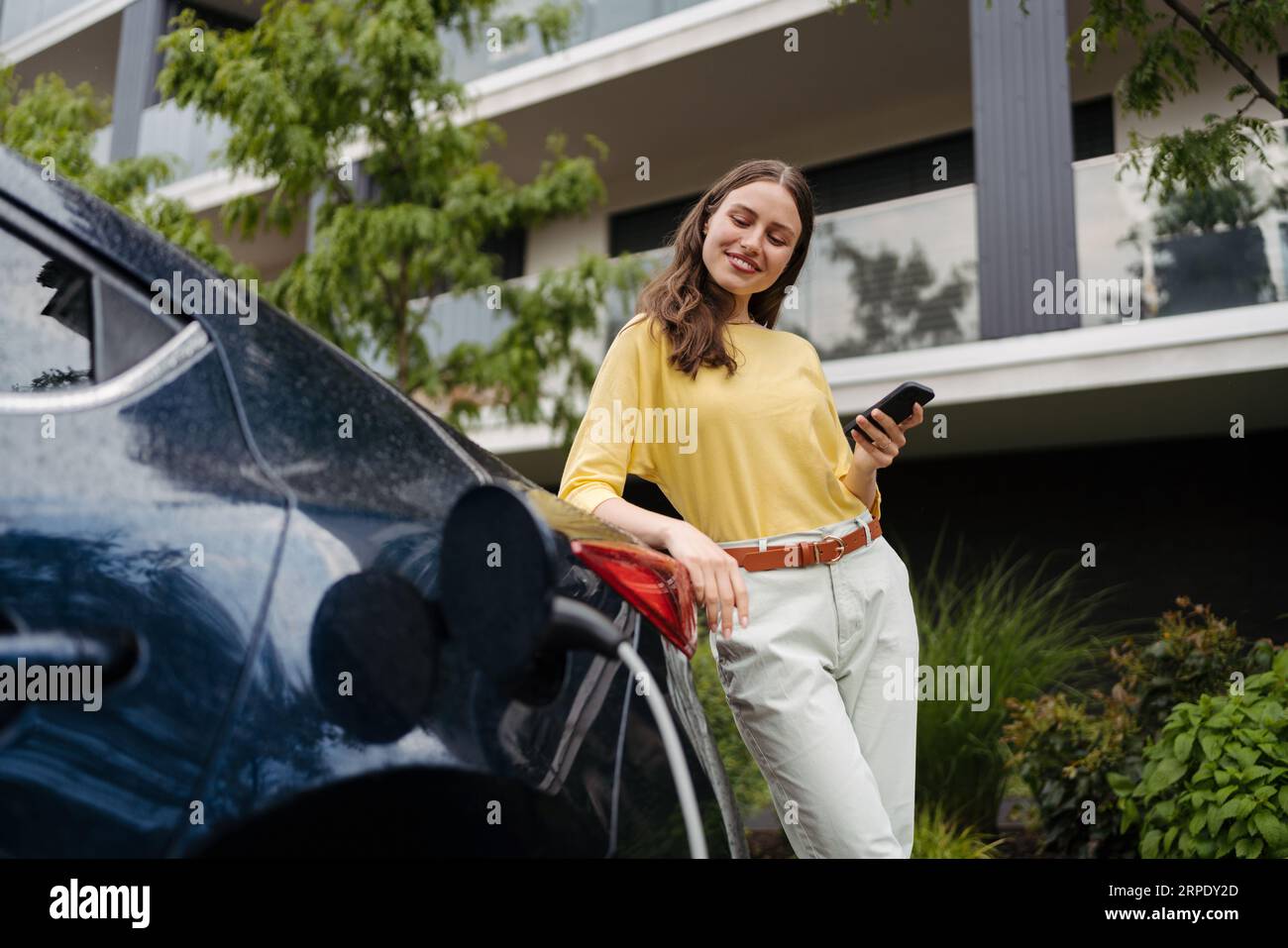 Woman plugging smartphone power hi-res stock photography and images - Alamy