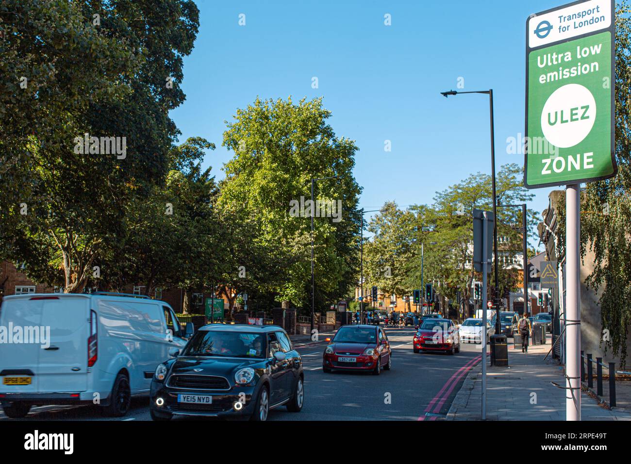ULEZ zone sign with traffic in background in Wandsworth, London ...